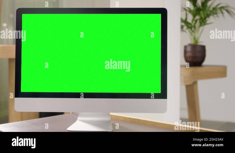 Apple IMac computer with green screen on office table Stock Video ...