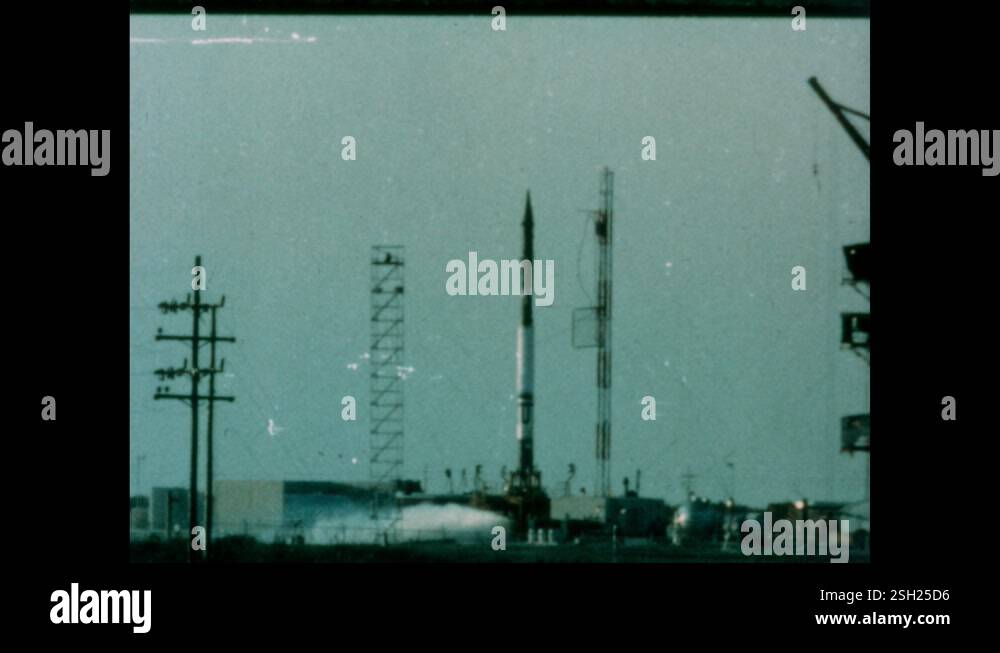 1960s:Rocket prepares for take off. Rocket launches, fire shoots from ...