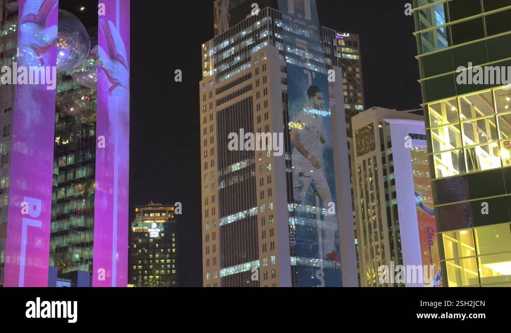 Building and big towers in doha qatar design with football player ...