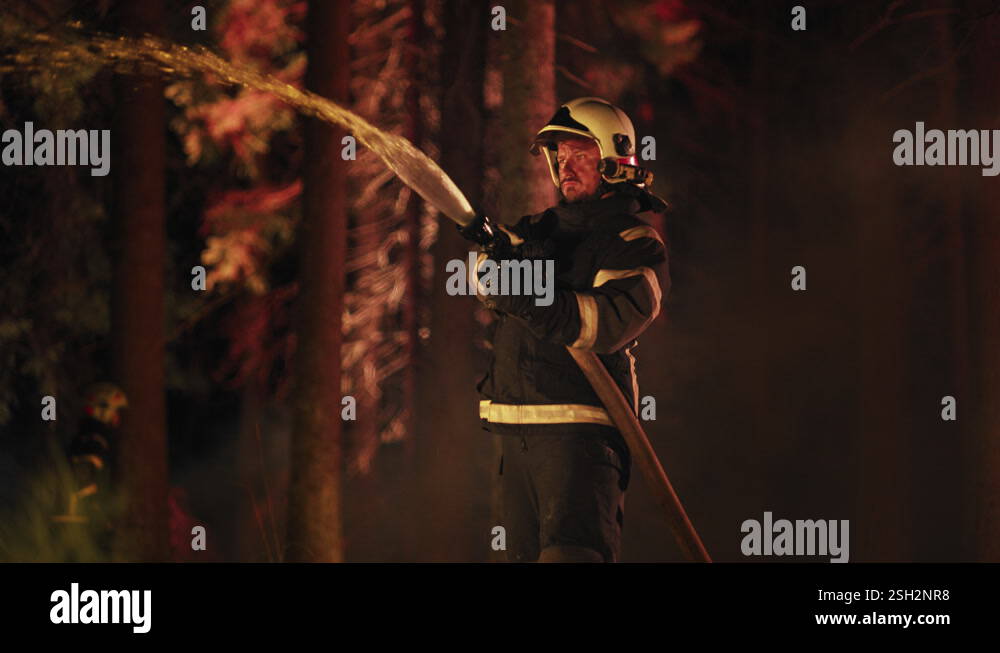 Firefighter Using Fire Hose to Battle Wildfire Stock Video Footage - Alamy