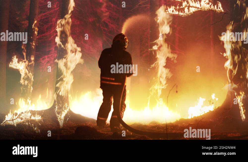 Firefighter Using Fire Hose to Battle Wildfire Stock Video Footage - Alamy