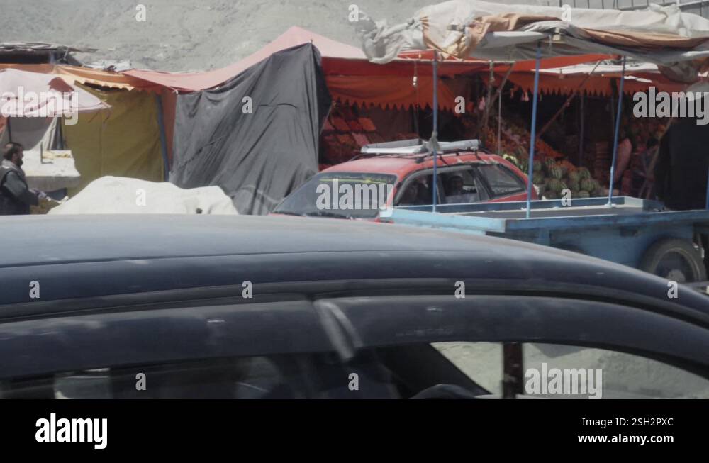 Man carry heavy bag in Kabul market and rush away, handheld view Stock ...