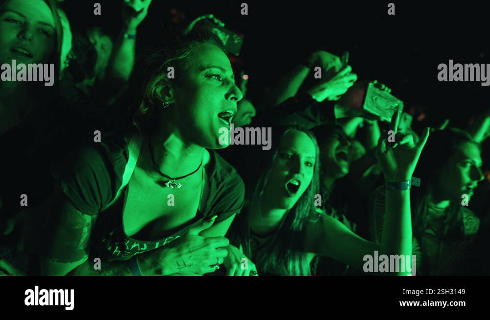 Young Woman Lady In Front Of Stage Cheering Singing During Music ...