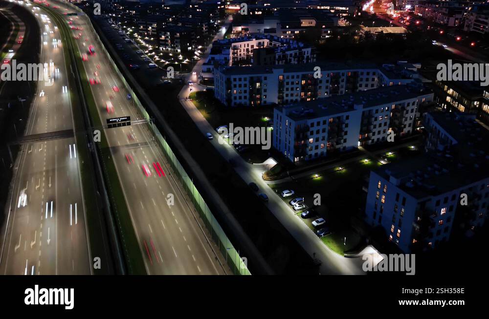Hyperlapse or Dronelapse Aerial view of Highway road next to City ...