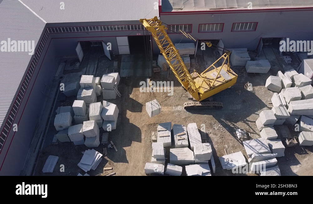 Multiple Big Stones are scattered around on the Ground at the Building ...