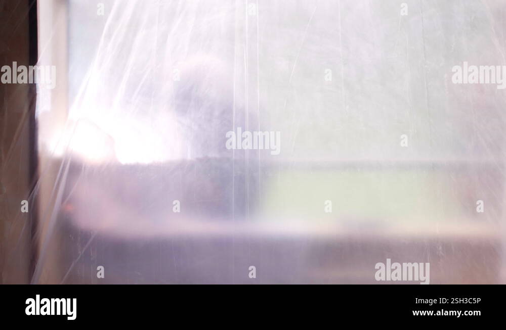 Process of house windows installation, workers behind the transparent ...