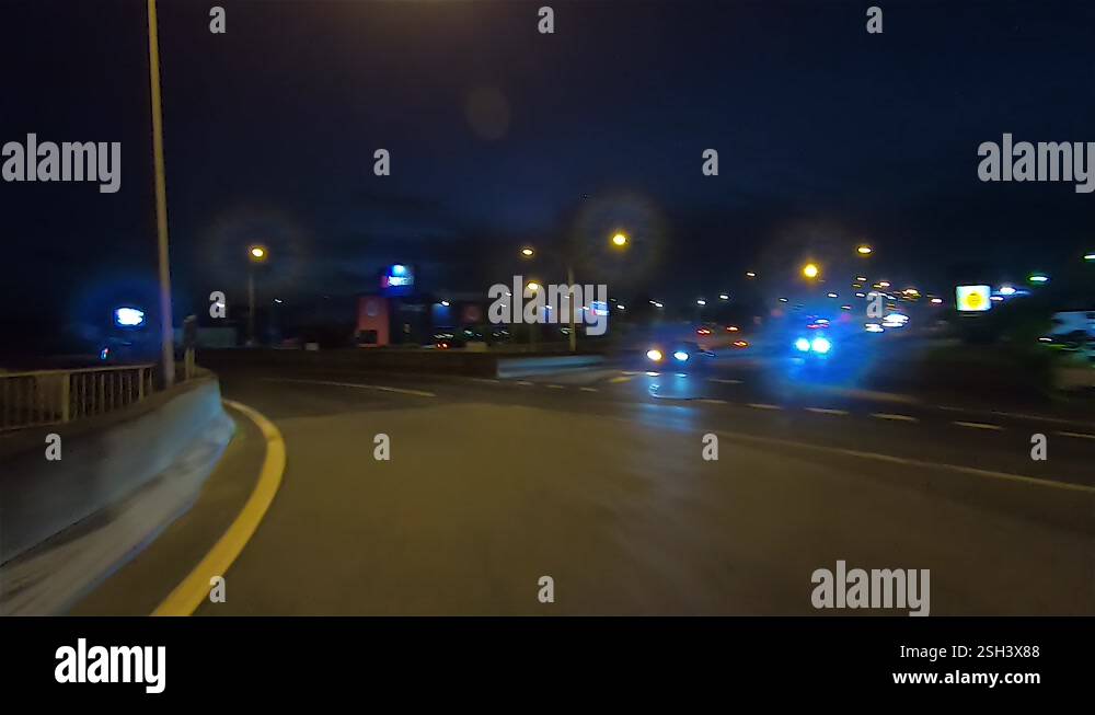 Rear facing night driving point of view POV for interior car scene ...