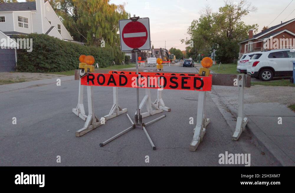 Road closed barricade sign in street residential approached Stock Video ...