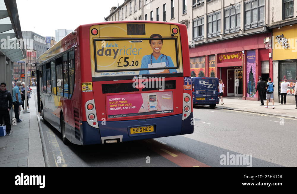 Alexander Dennis Enviro300 bus wating for incoming passengers at a bus ...