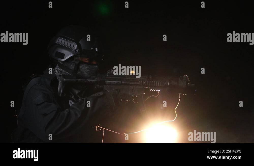 Soldier dressed in black with gun on anti-terrorism mission at night ...