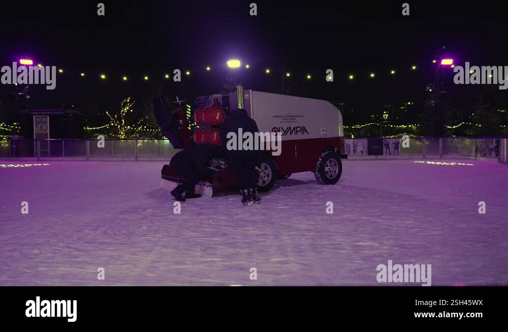 9 December 2022 - Worker Checking Olympia Ice Resurfacing Machine At ...