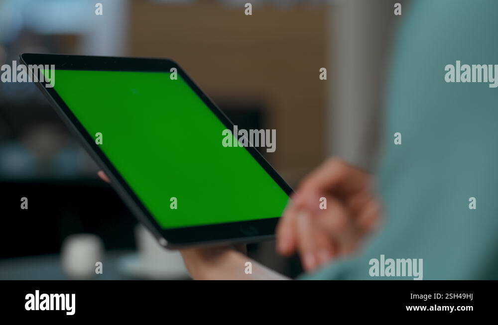 Woman hands zoom out green screen device closeup. Manager touching ...