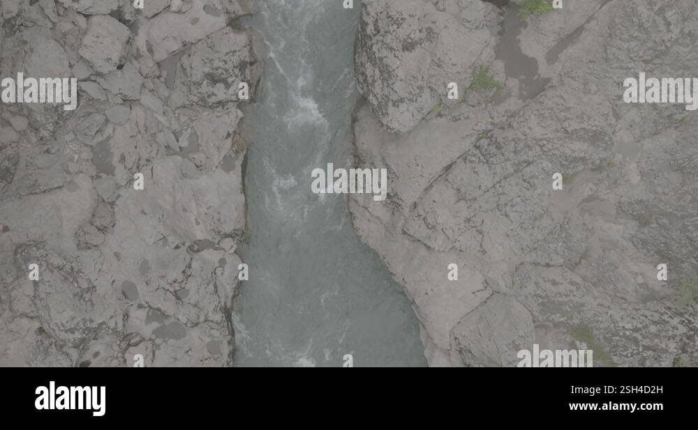 Mountain river. A rapid flow of clean water between rocks. Bubbling ...