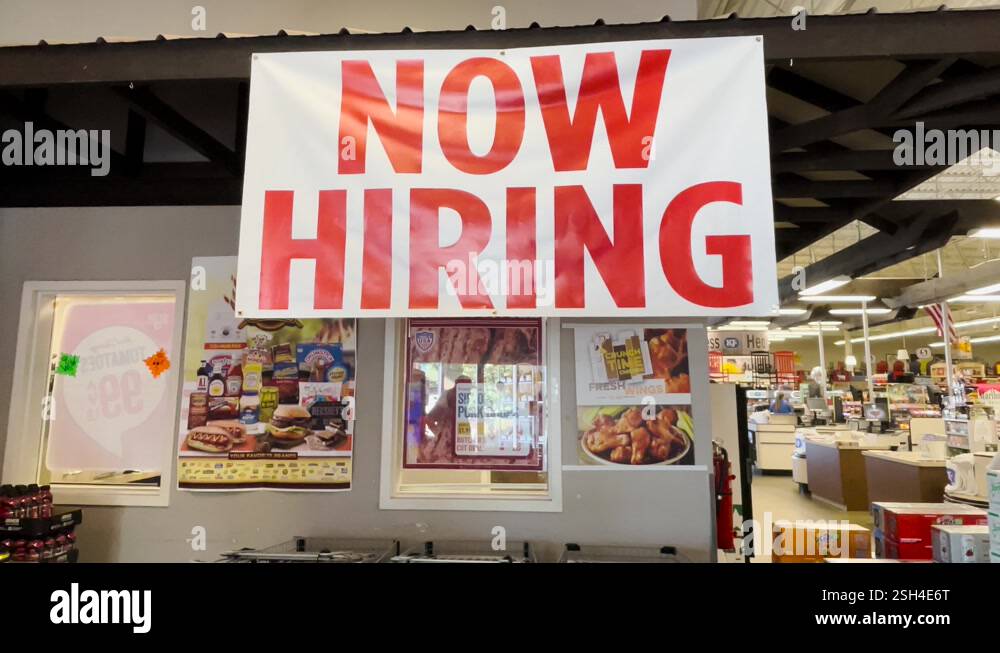 IGA grocery store interior Now Hiring banner at entrance of store Stock ...