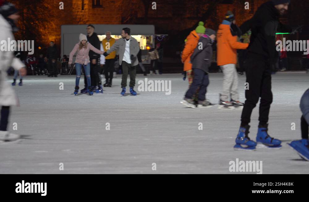 People Fall While Ice Skating at Budapest Exterior Ice Rink At Night ...