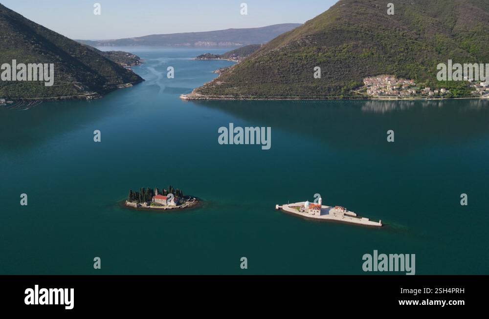 Our Lady of the Rocks and Gospa od Skrpjela islets against mountains ...