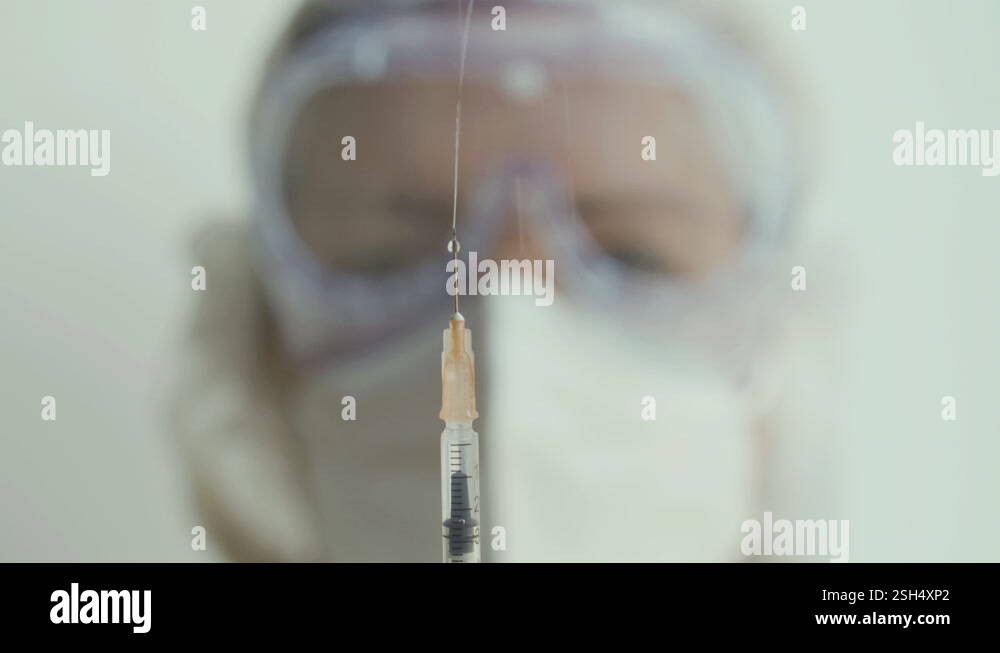 Close-up shot of doctor throwing vaccine out of syringe Stock Video ...