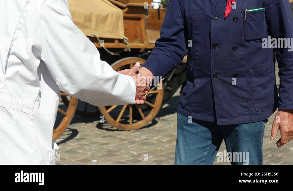 Two People Doing The Traditional Hand Clap After A Price Deal For The ...