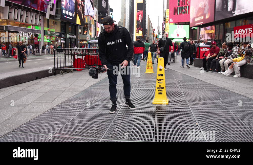 Film Maker Dan Mac Filming Grate Vents In Times Square In New York ...