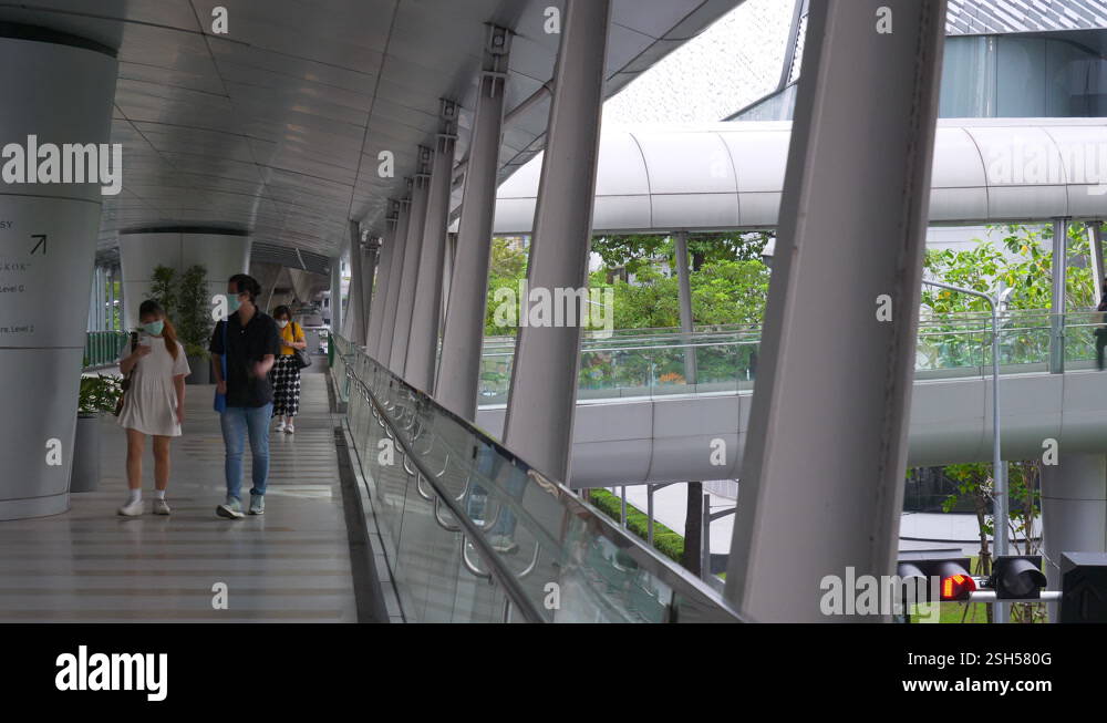 day time bangkok city center pedestrian walkway bridge pov 4k thailand Stock Video Footage - Alamy