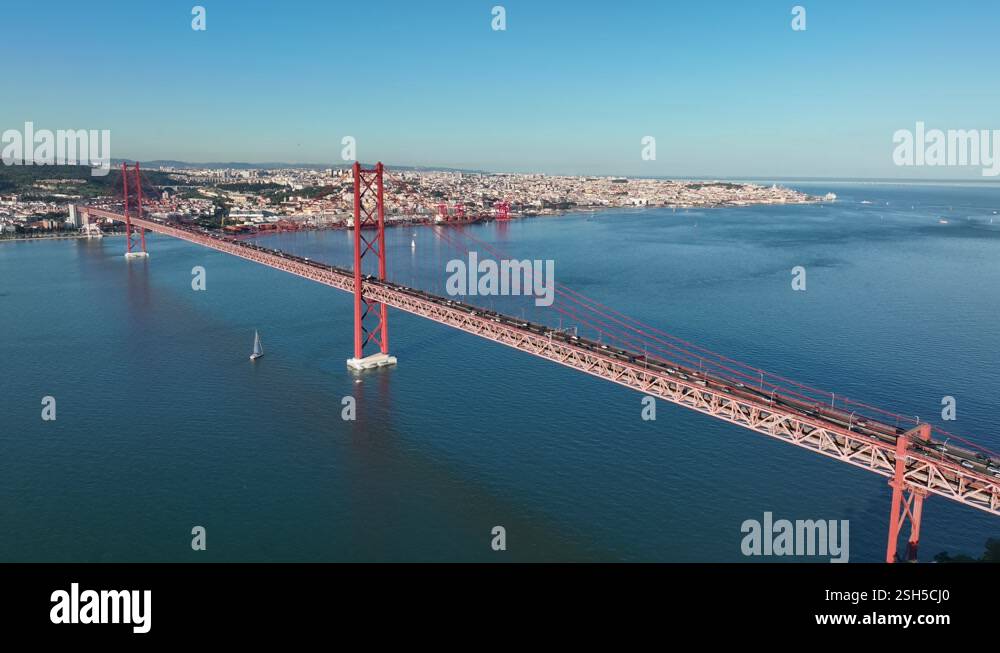 The 25 April bridge (Ponte 25 de Abril) located in Lisbon, Portugal, crossi Stock Video Footage ...