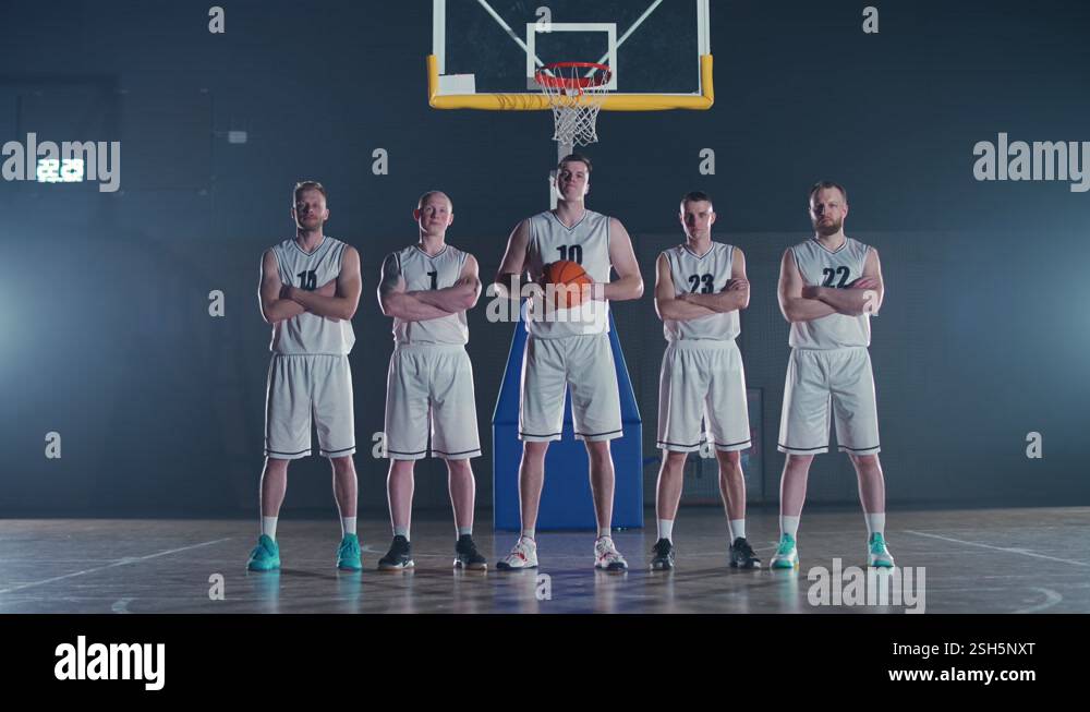 Performance, group of basketball players stands on the playground, the ...