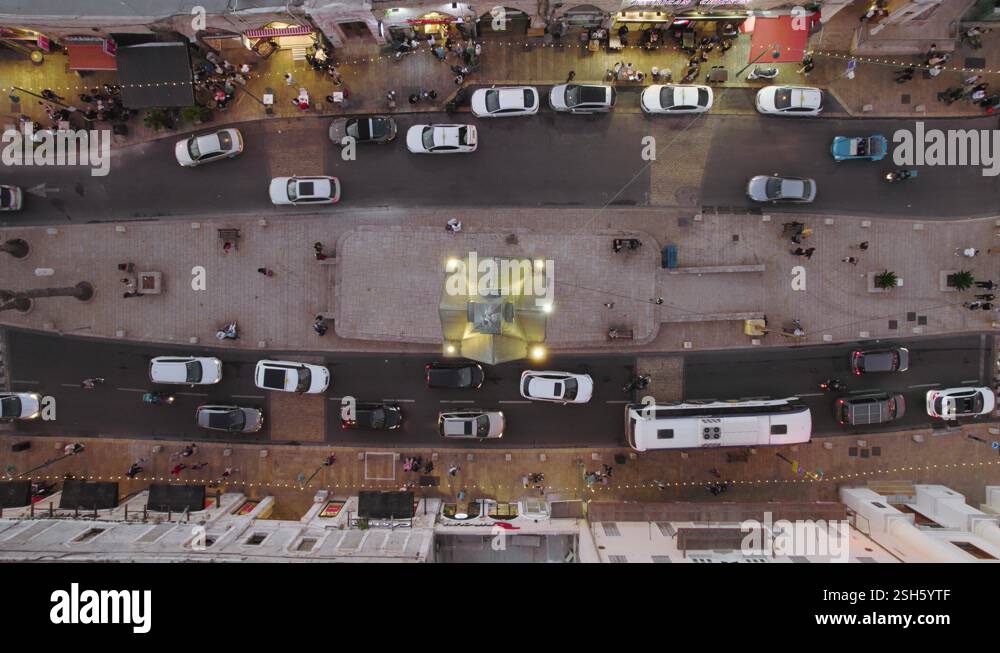 Top down view of Jaffa clock tower while cars and pedestrians passing ...