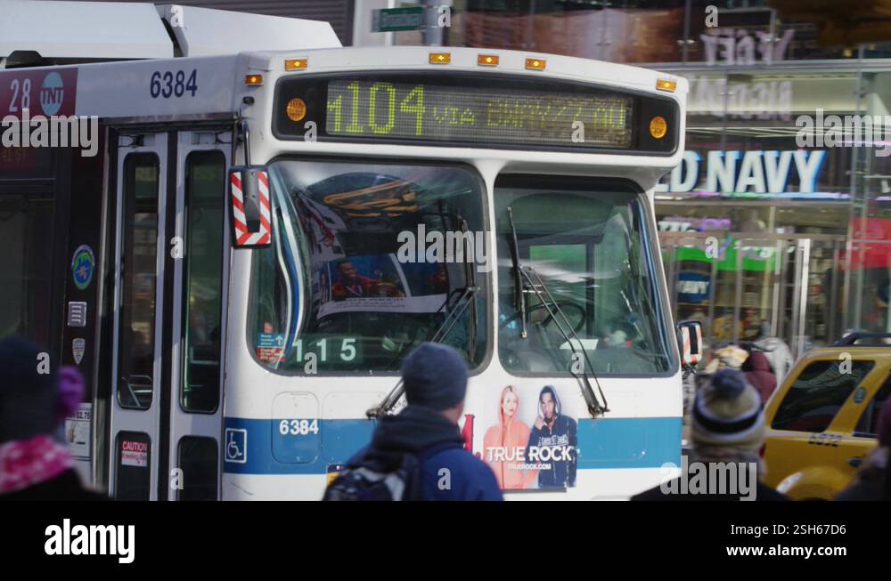 Bus driving past crowds on busy street in New York City Stock Video ...