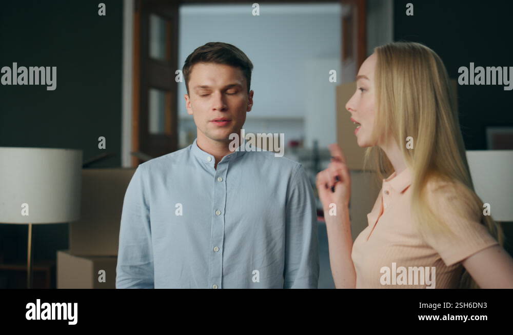 Conflicted wife swearing husband at home waving finger close up. Family ...