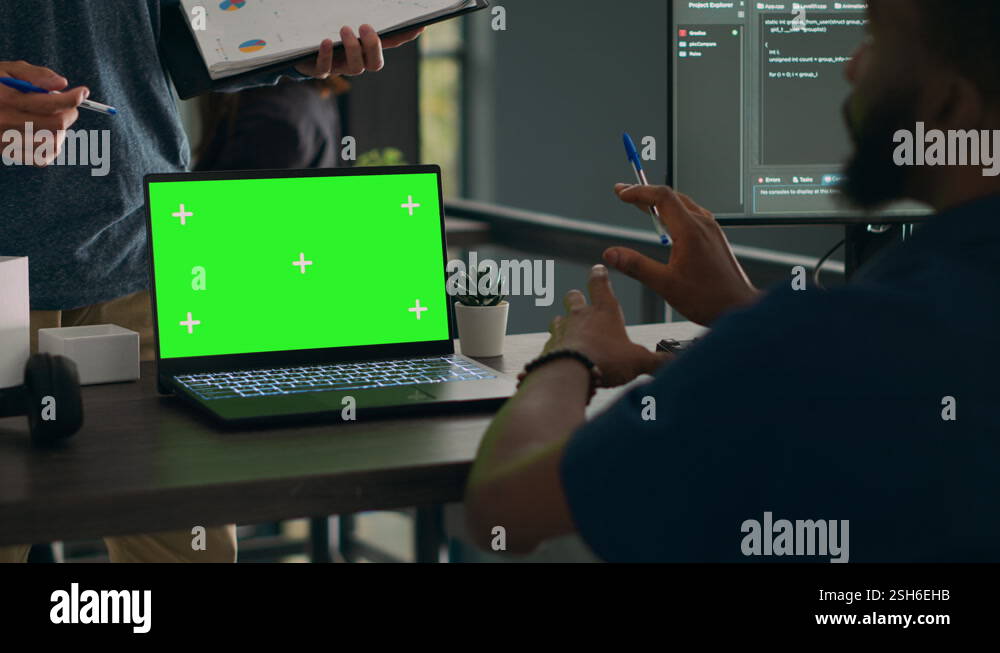 Database Admins Analyzing Source Code And Greenscreen Display On 8352