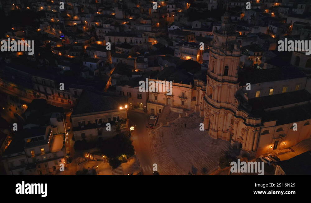 dusk descending on Cathedral of Saint George revealing historic Modica ...