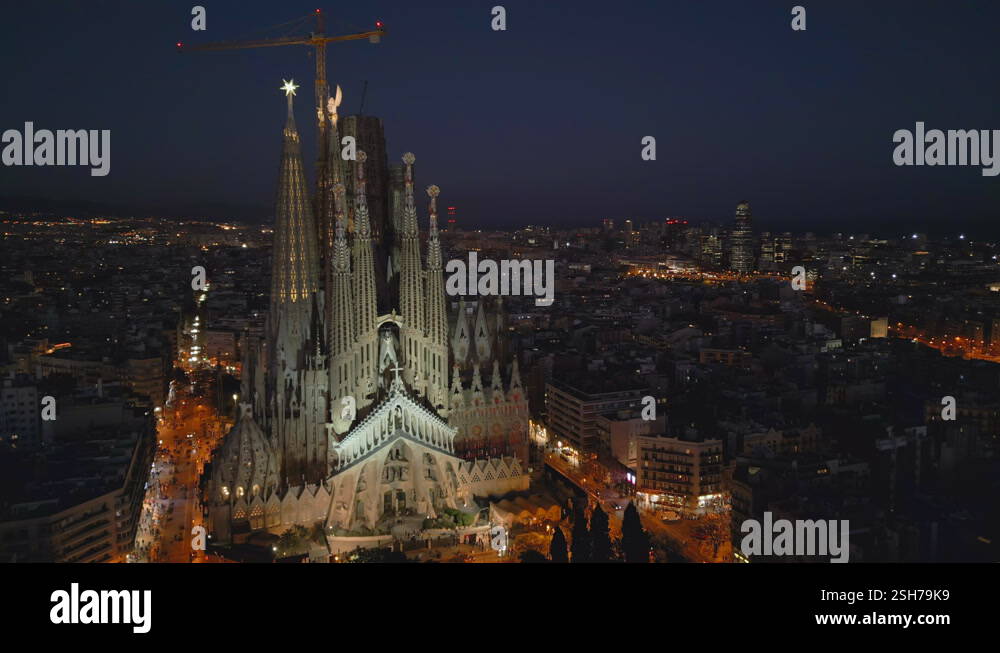 Evening flying counter clockwise around Sagrada Familia Cathedral in ...