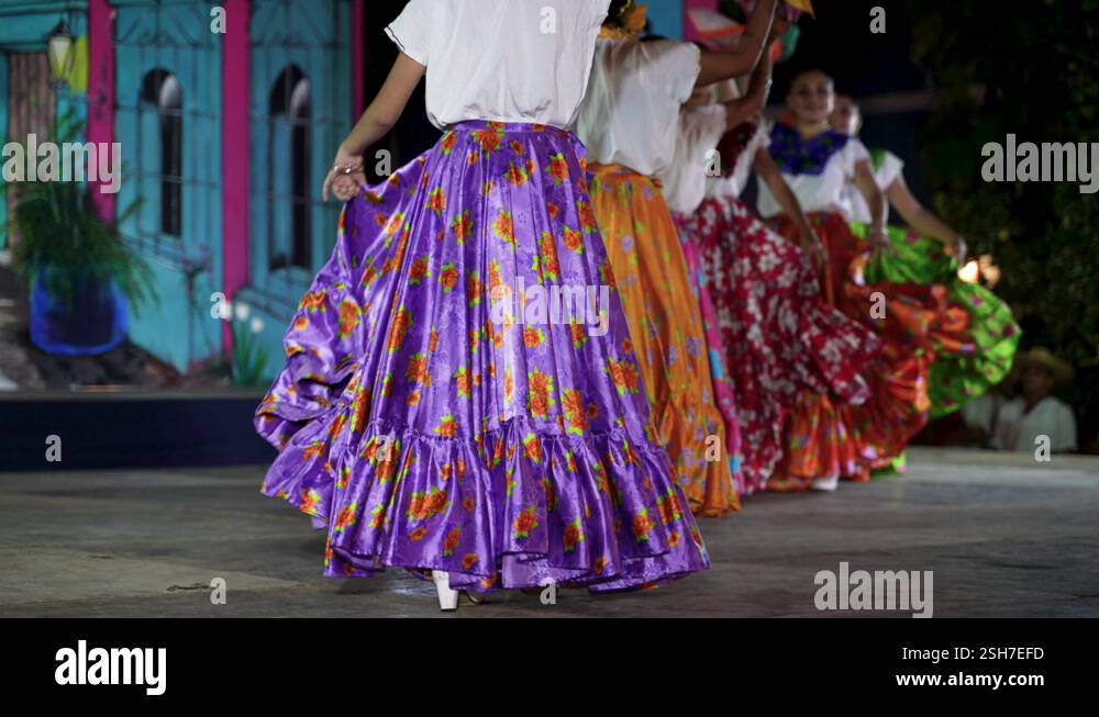 Women in line dancing a Mexican cultural folk dance sharing the ...