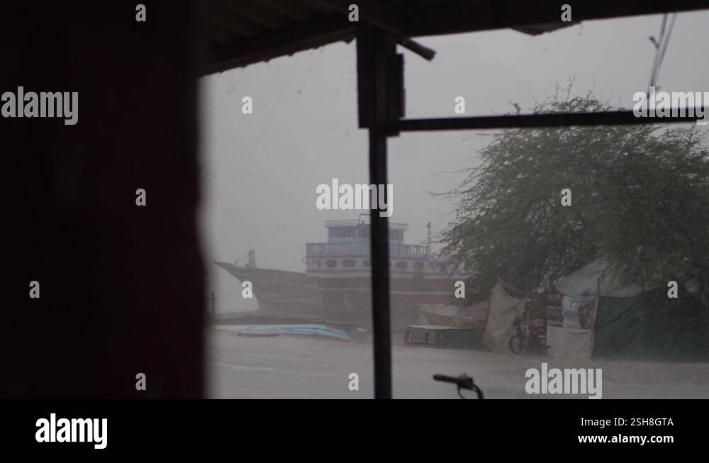 Looking Through Window At Heavy Rain Falling At Gwadar Fishing Port On ...