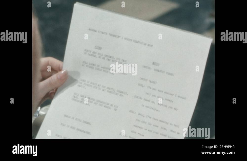 1960s: Woman rolls a partially-typed paper into typewriter. Woman types ...