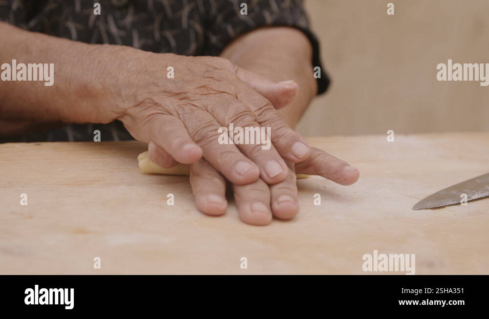 Hands rolling pasta Stock Videos & Footage - HD and 4K Video Clips - Alamy
