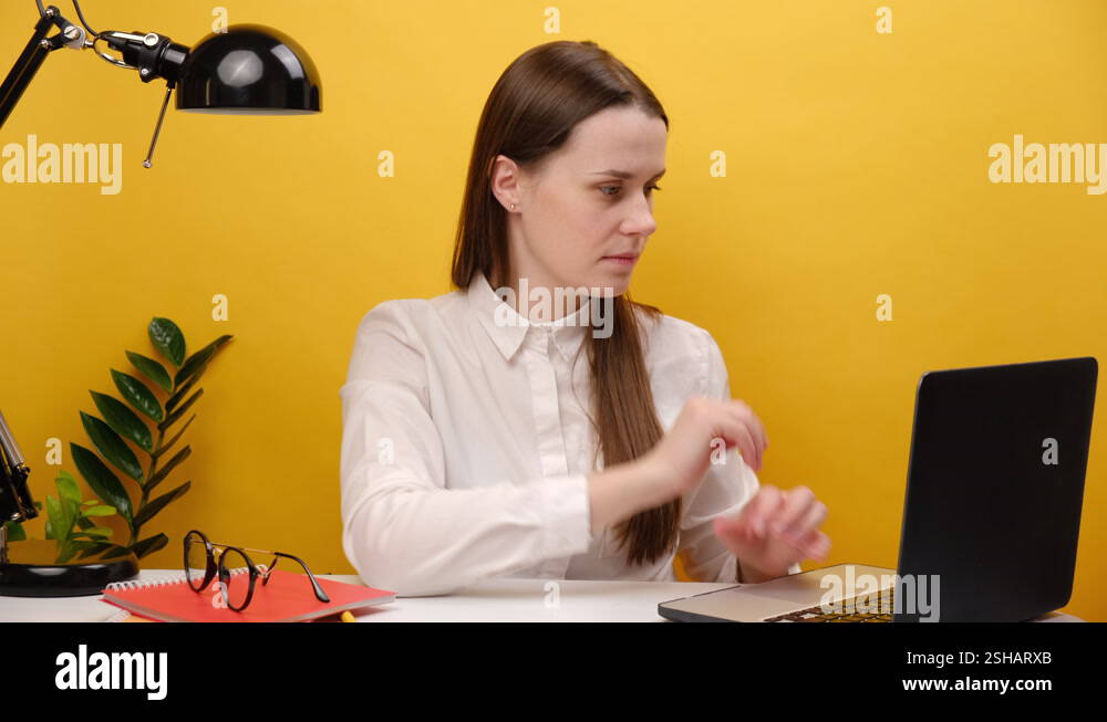 Employee business woman sit work at office desk with laptop hold hands ...