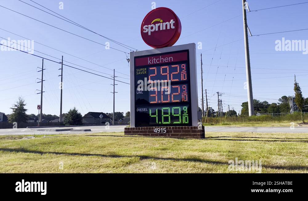 Sprint gas station fuel price street sign and traffic Stock Video ...