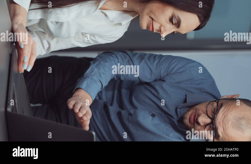 Vertical Screen: Boss talking to employee in office Stock Video Footage ...