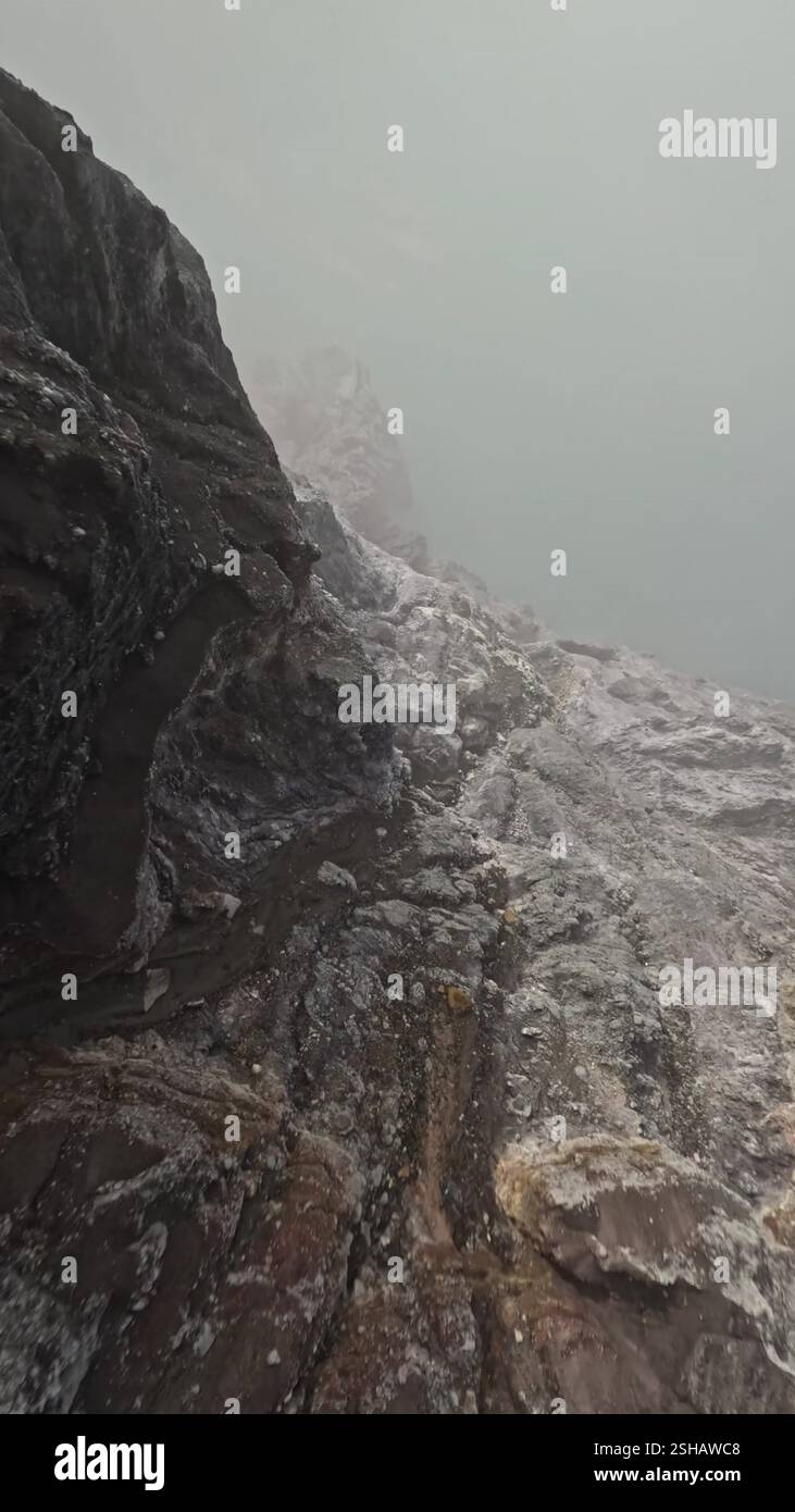 Man running in respiratory mask tropical island volcano dive to crater ...
