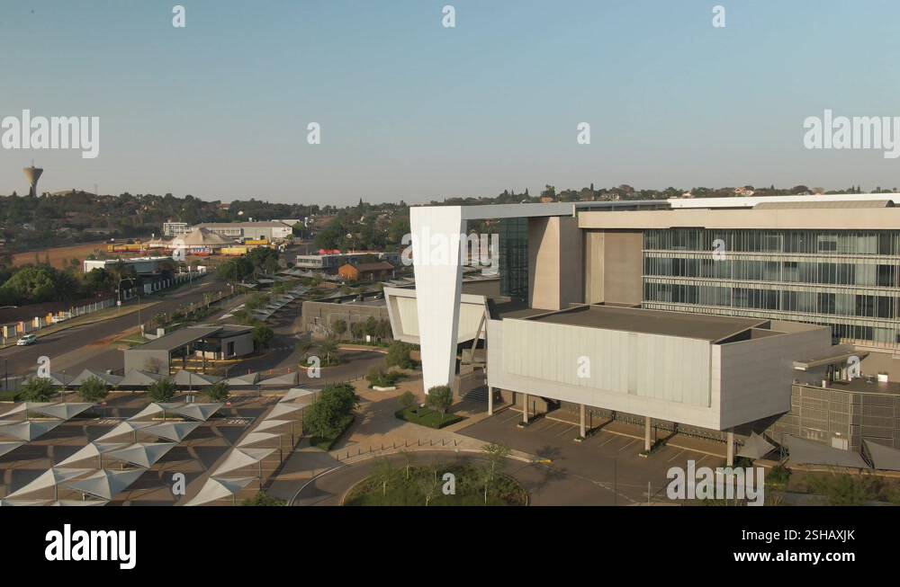 Drone aerial footage of a Modern Office building with a big arch Stock ...