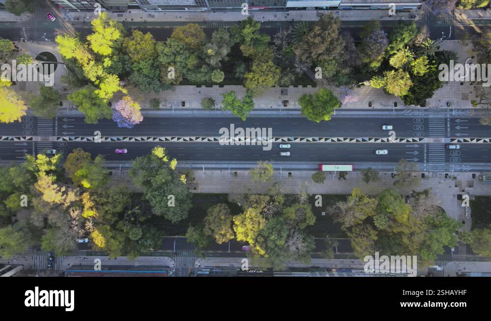 Aerial birds eye overhead top-down view of traffic in wide city street ...
