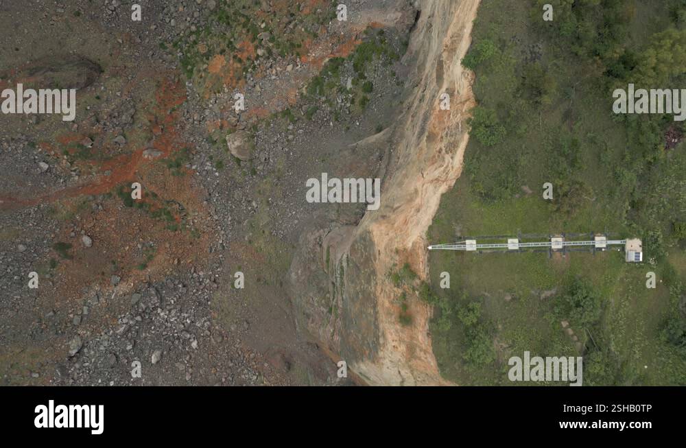 Bird's eye view of vertical rock walls in diamond mine open pit, ZA ...