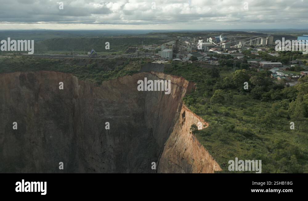 Huge steep rock cliffs in big hole of Cullinan Diamond Mine open pit ...