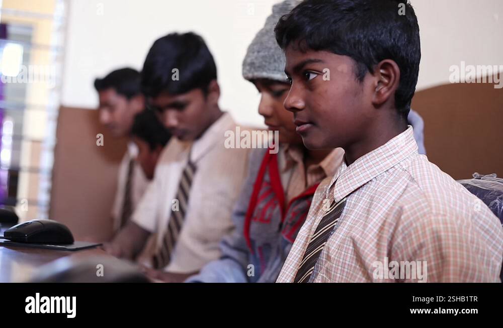 A view of indian male students using computers at school Stock Video Footage - Alamy