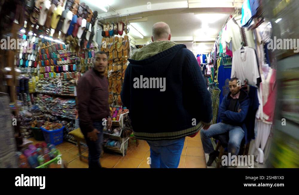 Marrakech, Marocco: The busy souk downtown with salesmen and tourists ...