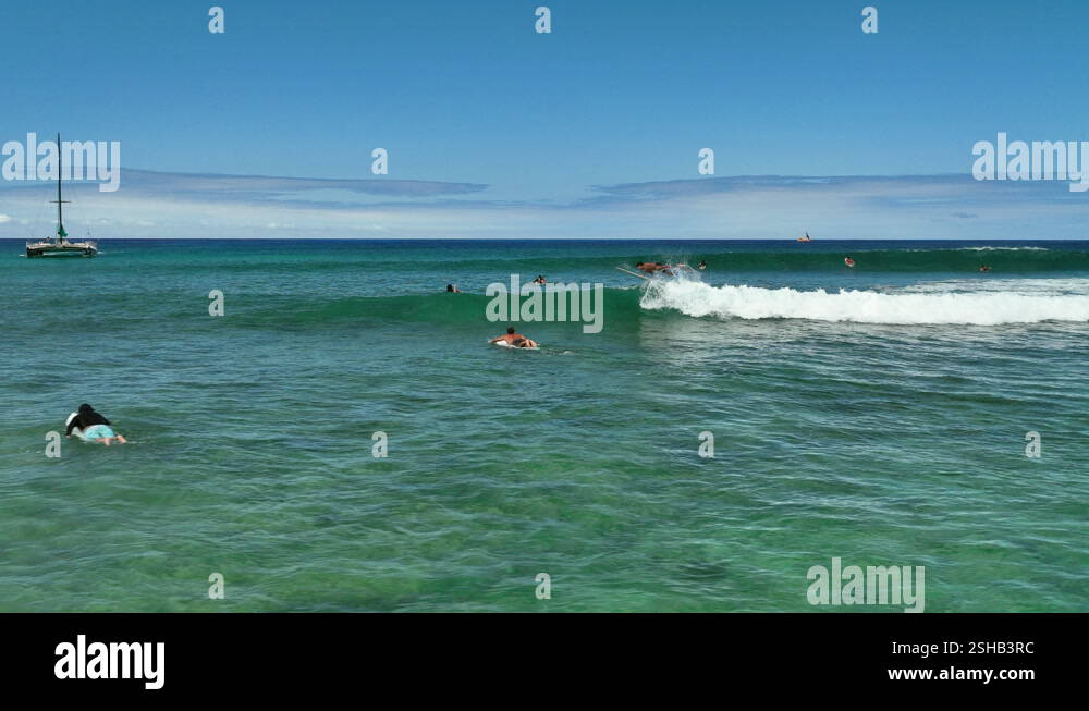 Slow Motion Panning Shot Of People Surfboarding On Waves In Sea During ...