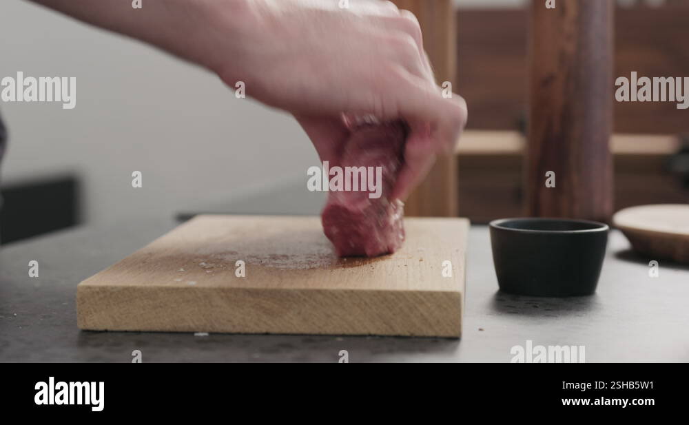 Man seasoning raw ribeye steak on oak wood board Stock Video Footage ...
