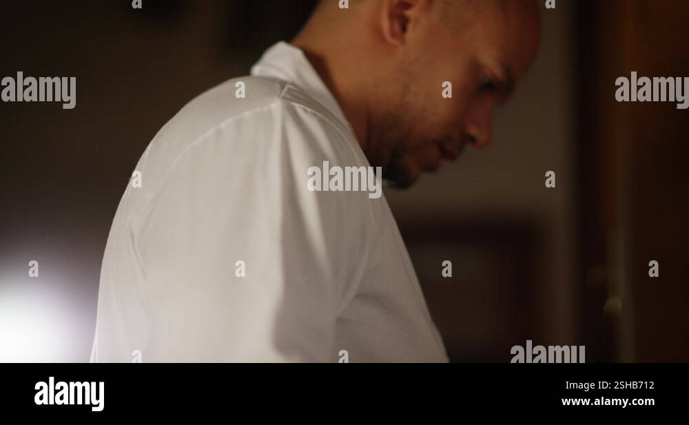 Scientist putting on his lab coat before experimentations Stock Video ...