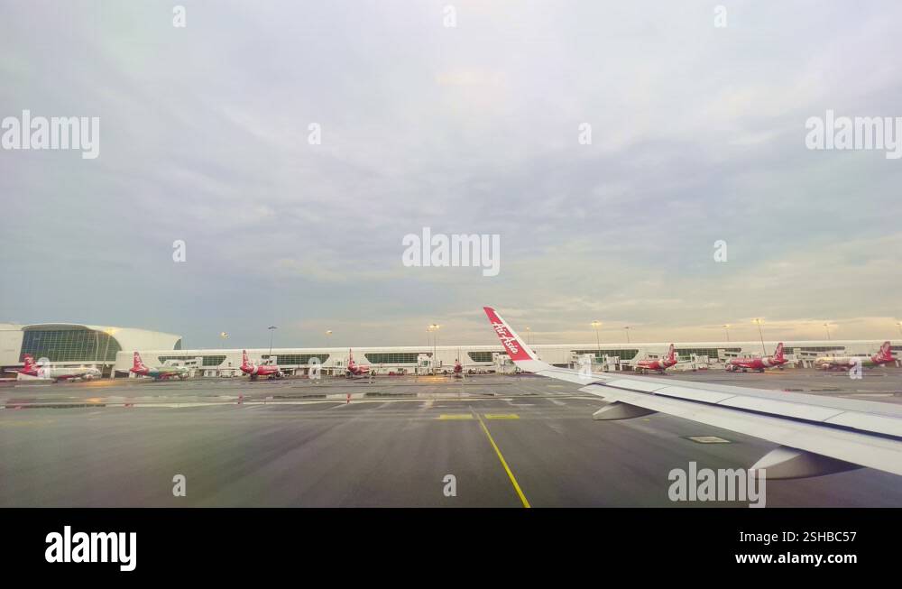 View of airport from the window of the airplane. View docked away ...
